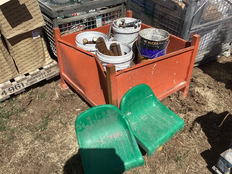A stillage with steel pins and a variety of nuts and bolts. Auction ...
